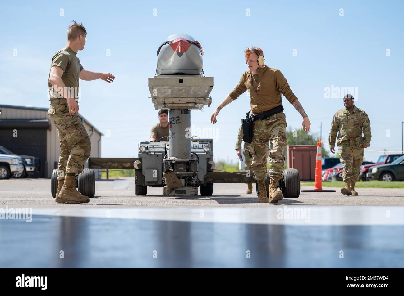 Weapons load crew members assigned to the 7th Aircraft Maintenance Unit ...