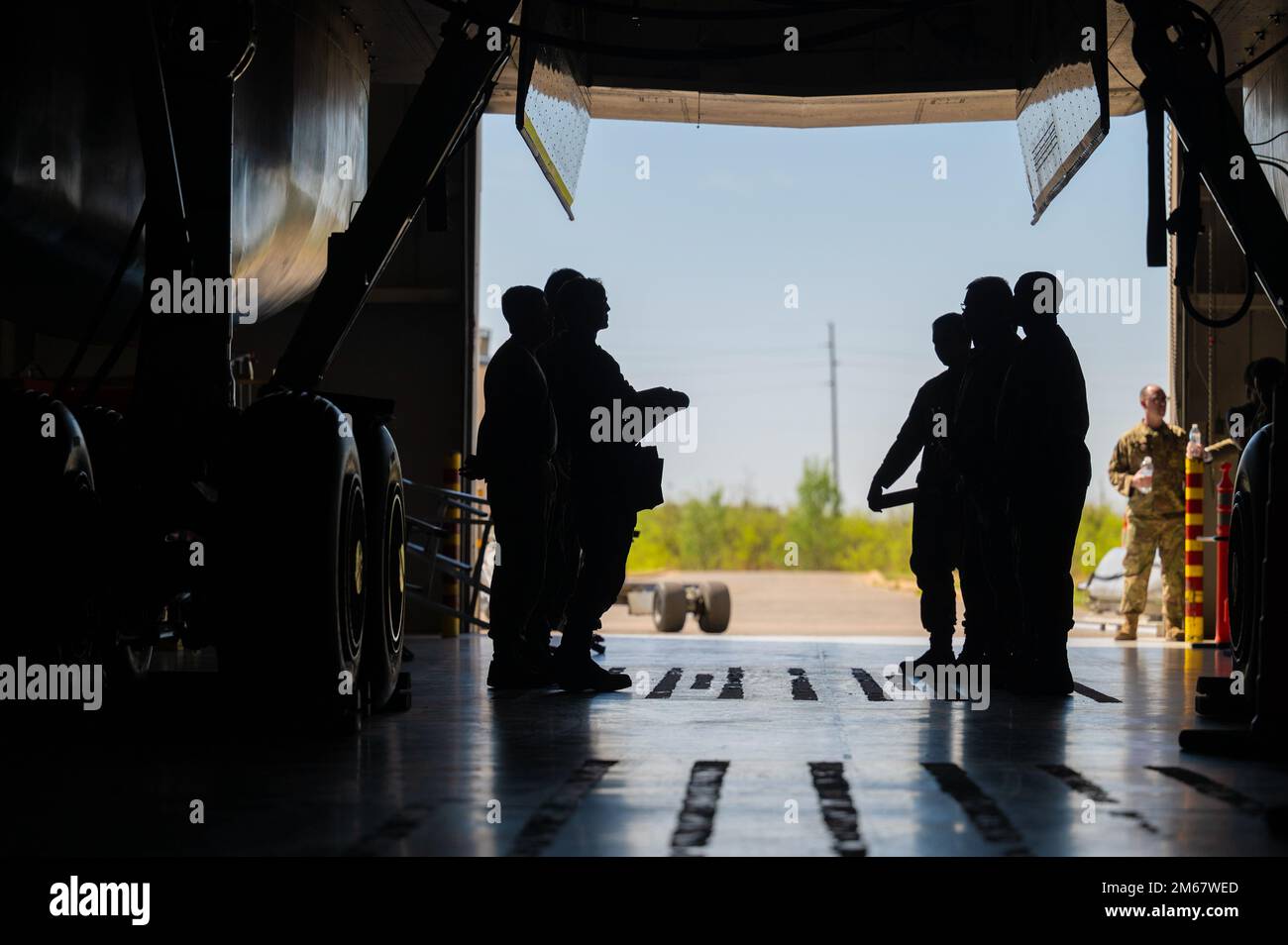 Weapons load crew members assigned to the 7th Aircraft Maintenance Unit ...