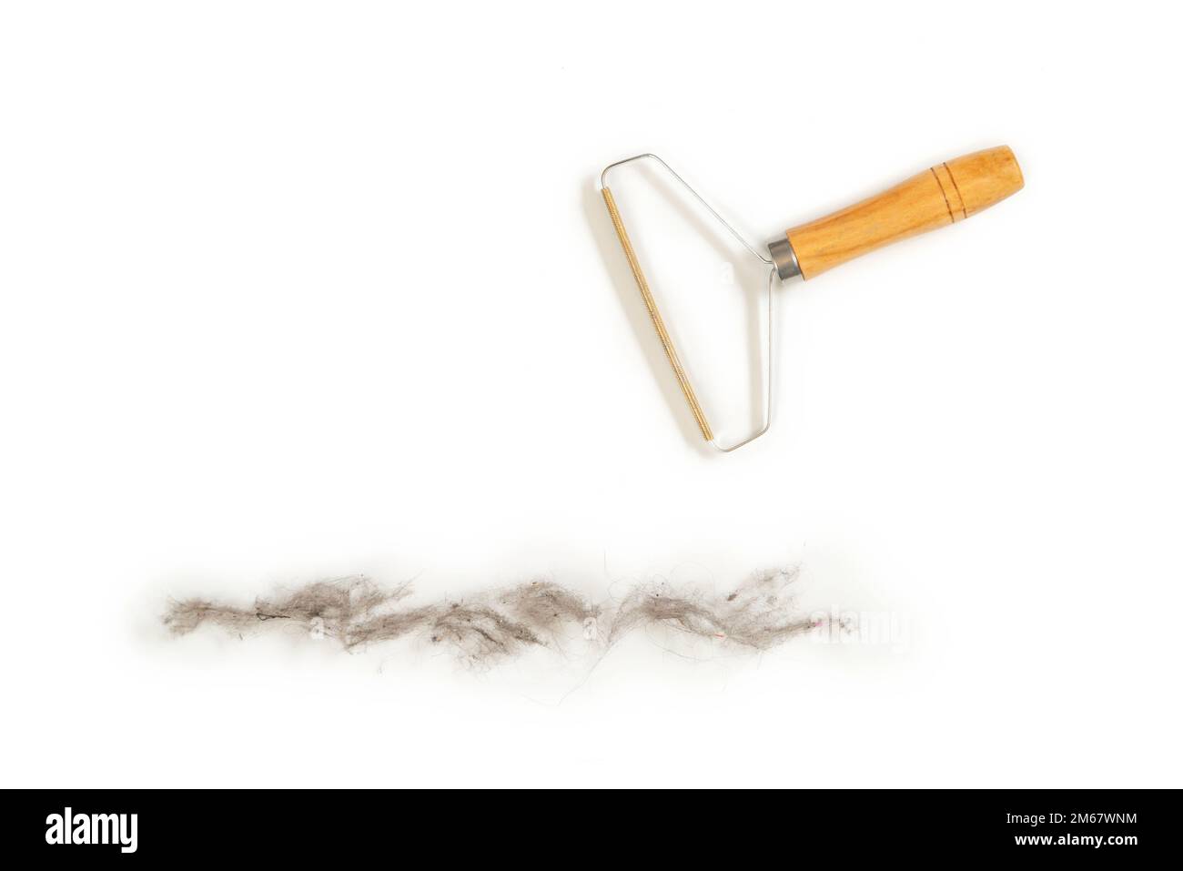 Top view of dust ball and carpet scraper tool on white background. Rug ...