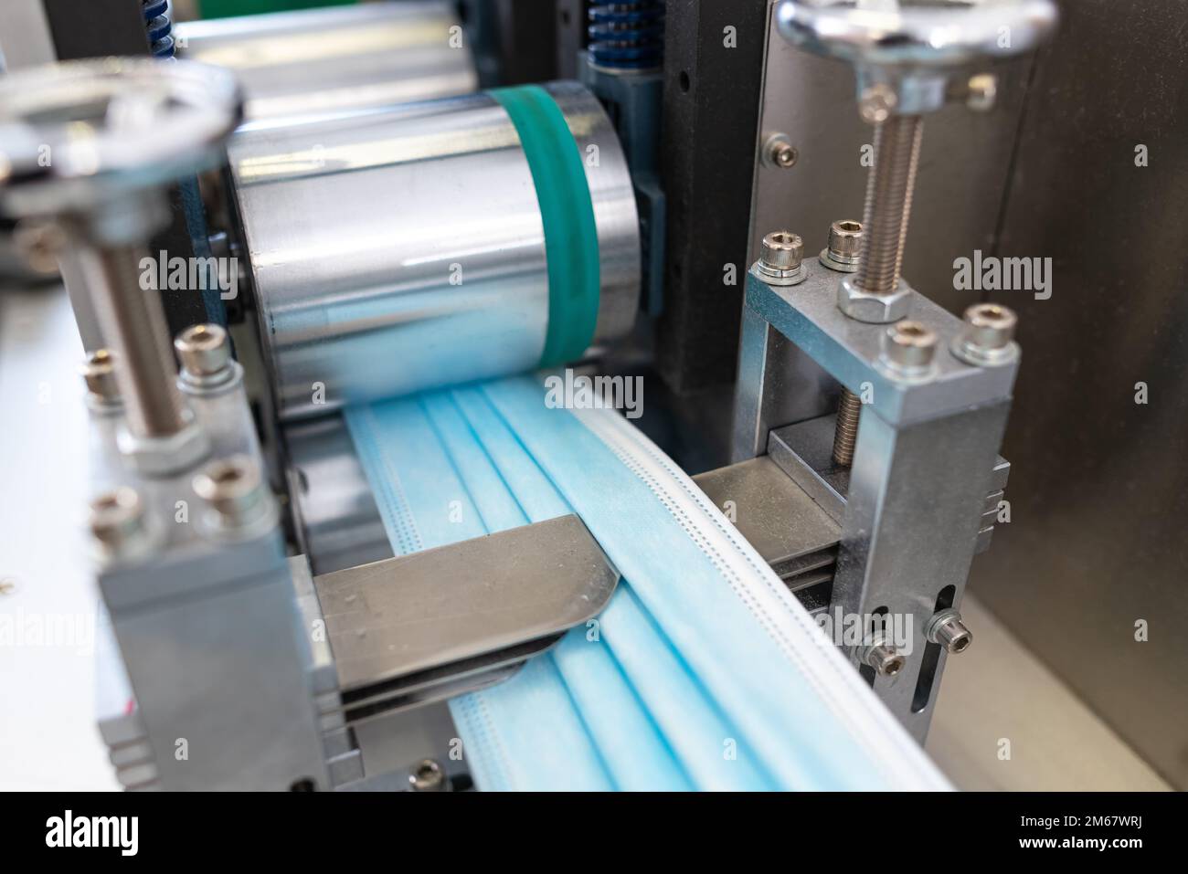 Closeup process of medical face masks being made in a factory ...