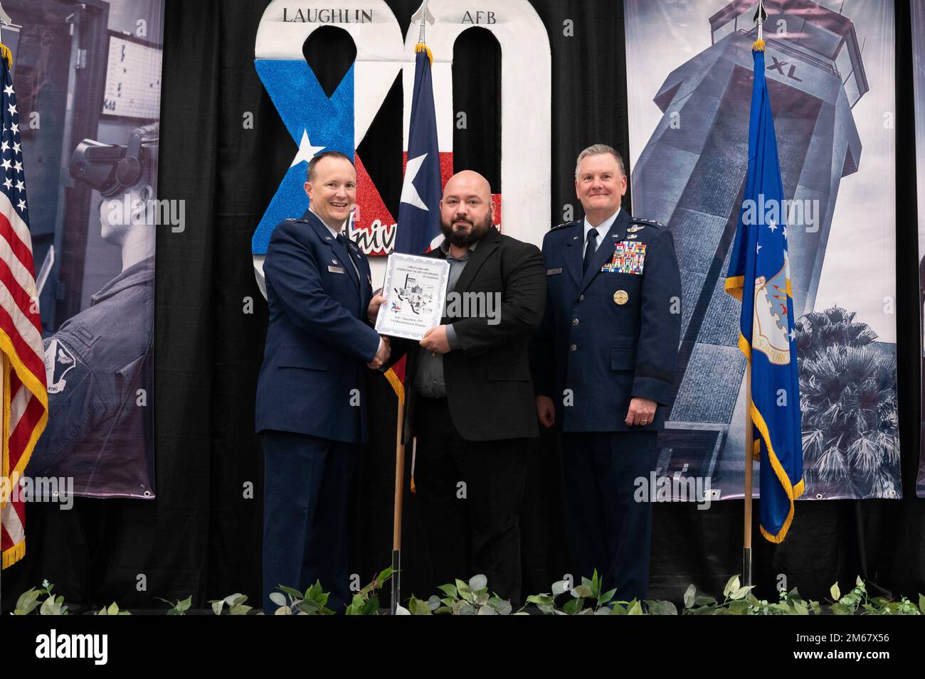 Mr. Michael Meza, T-6 Texan II Maintenance Superintendent, accepts an ...