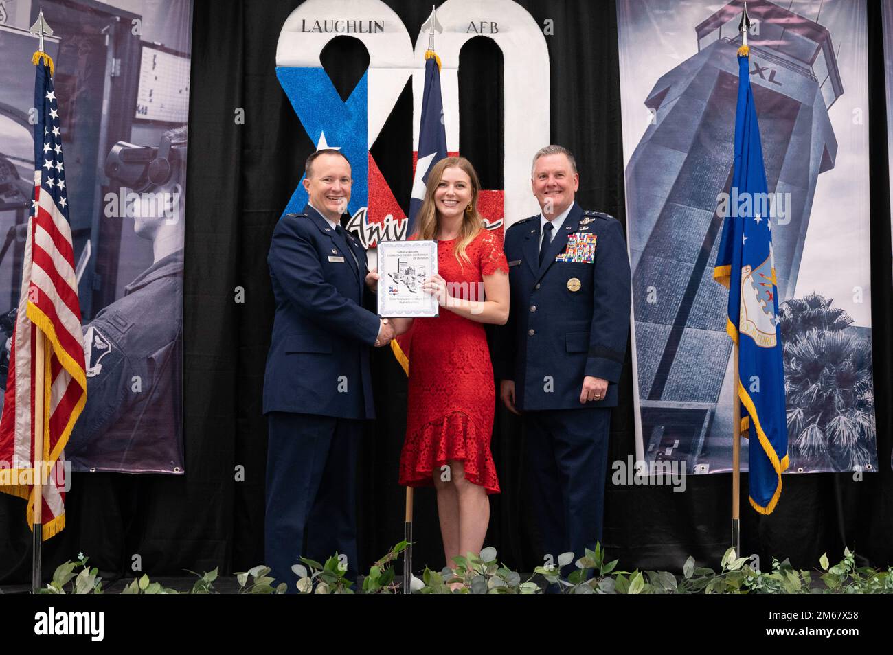 Ms. Kera Froembling, member of the 47th Operations Group, accepts an ...