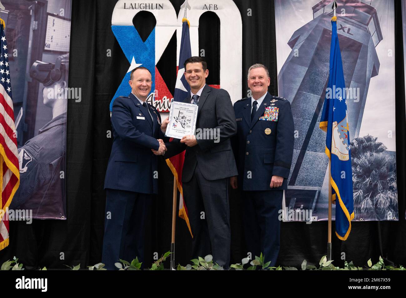 Mr. Johannes Thief, member of the 47th Mission Support Group, accepts ...