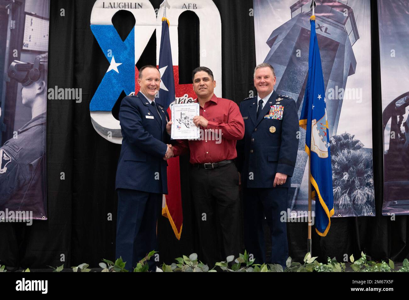 Mr. Edward Garcia, member of the 47th Maintenance Group, accepts an ...
