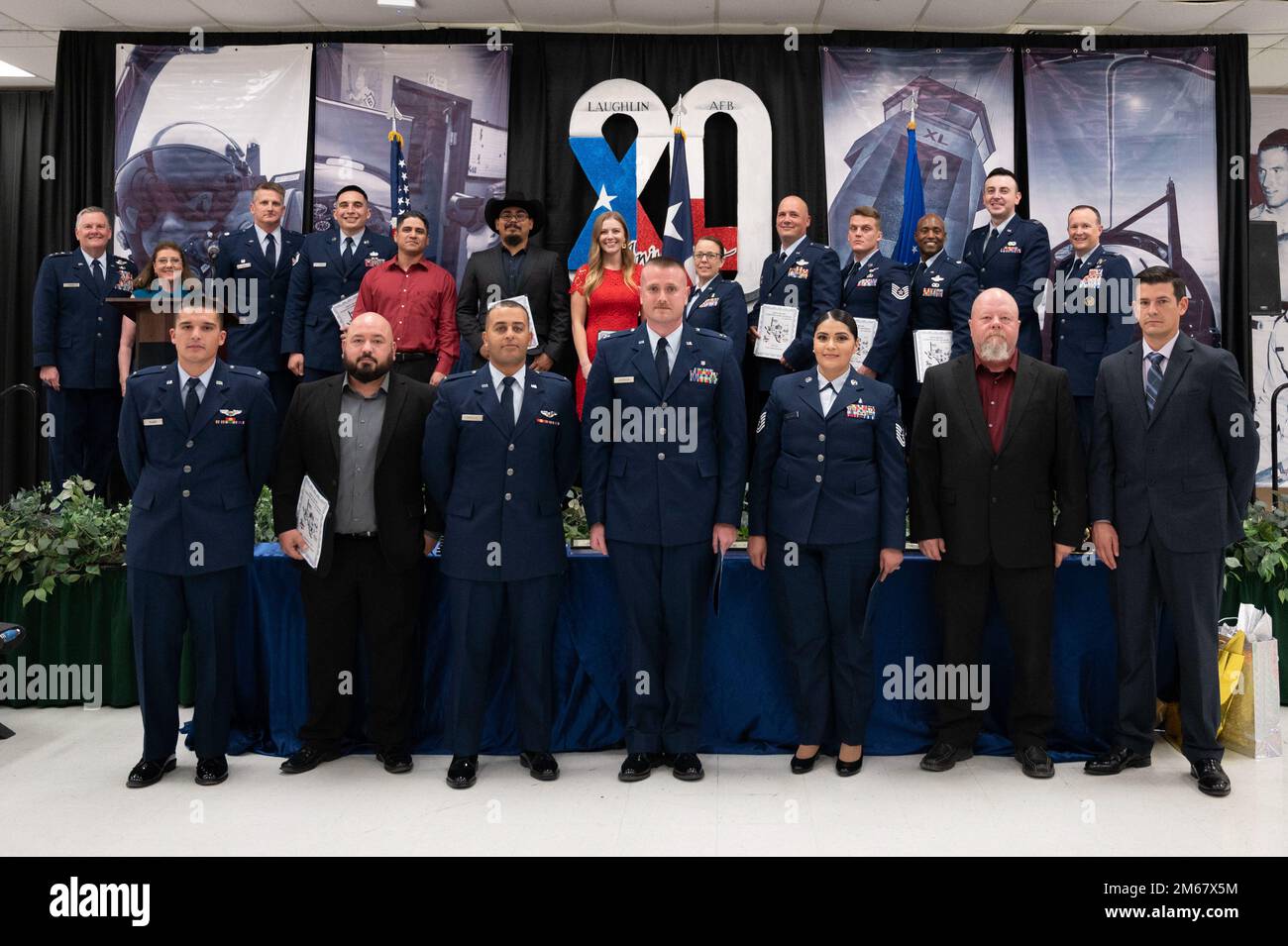 Award winners or their representatives pose for a photo with Col. Craig ...
