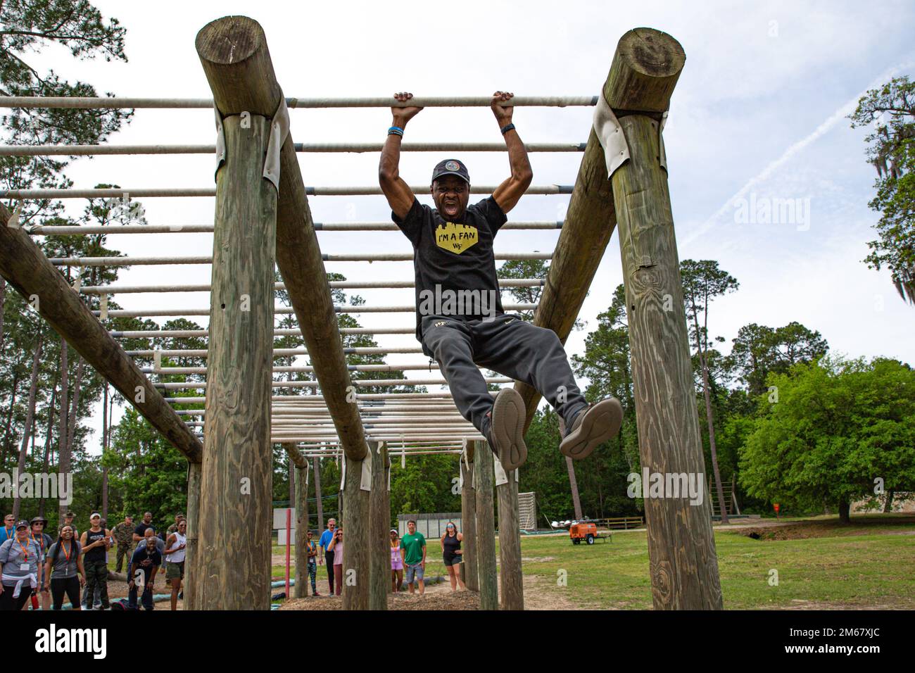 An educator with Recruiting Station Raleigh completes the monkey bar ...