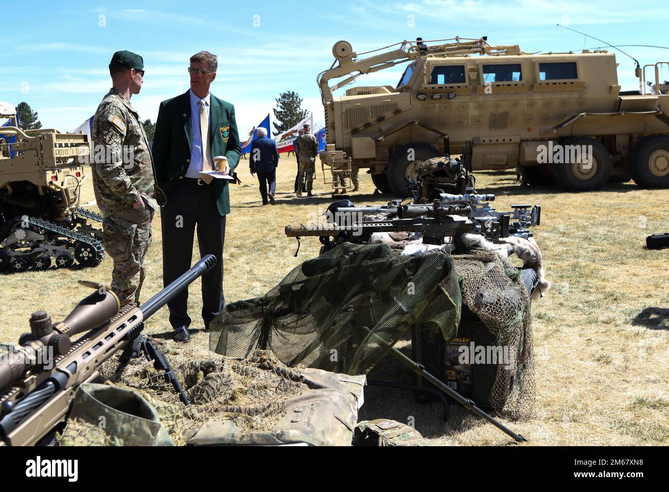 A member of the Fort Carson Good Neighbors talks to a member of the ...