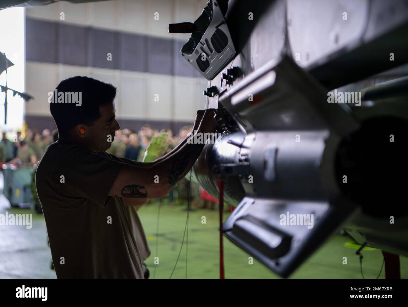 Staff Sgt. Jake Charloff, 34th Fighter Generation Squadron weapons crew team chief, secures a ...