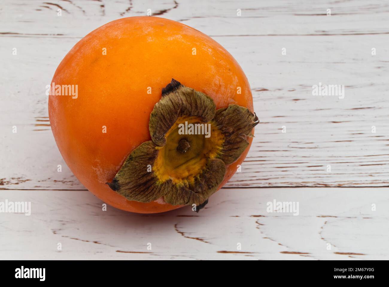 Fresh ripe persimmon isolated on white background Stock Photo - Alamy