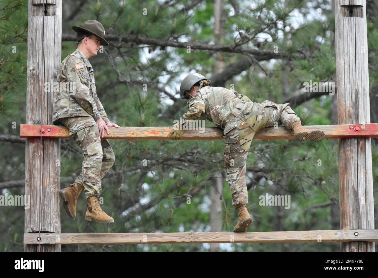 A Basic trainee completes obstacles at Fort Benning's Confidence Course ...