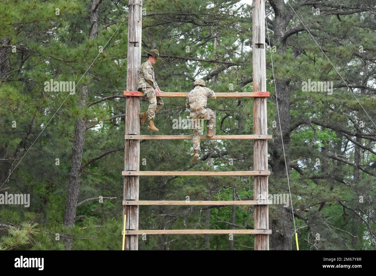 A Basic trainee completes obstacles at Fort Benning's Confidence Course ...