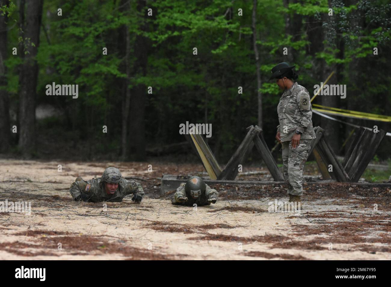Trainees complete hand release push-ups while waiting for teammates to ...