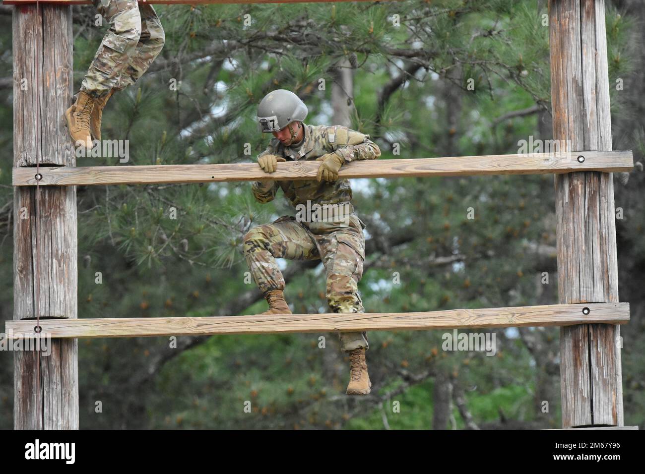 A Basic trainee completes obstacles at Fort Benning's Confidence Course ...