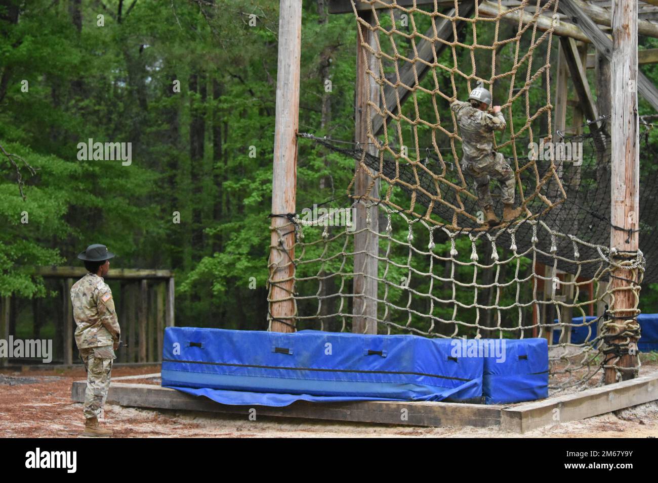 A Basic trainee completes obstacles at Fort Benning's Confidence Course ...