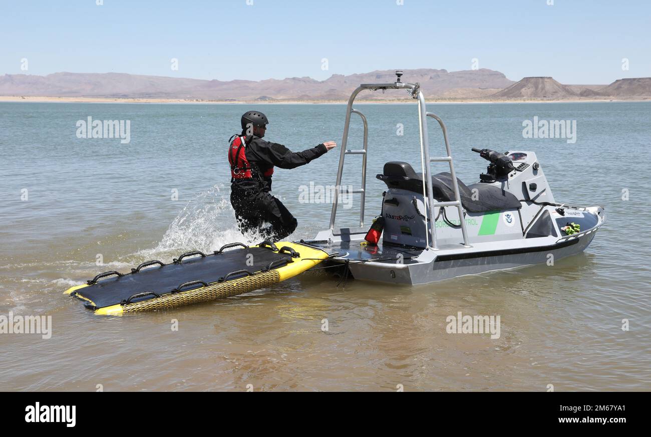 A Border Patrol Agent moves to a specially built AlumaPro Rescue ...