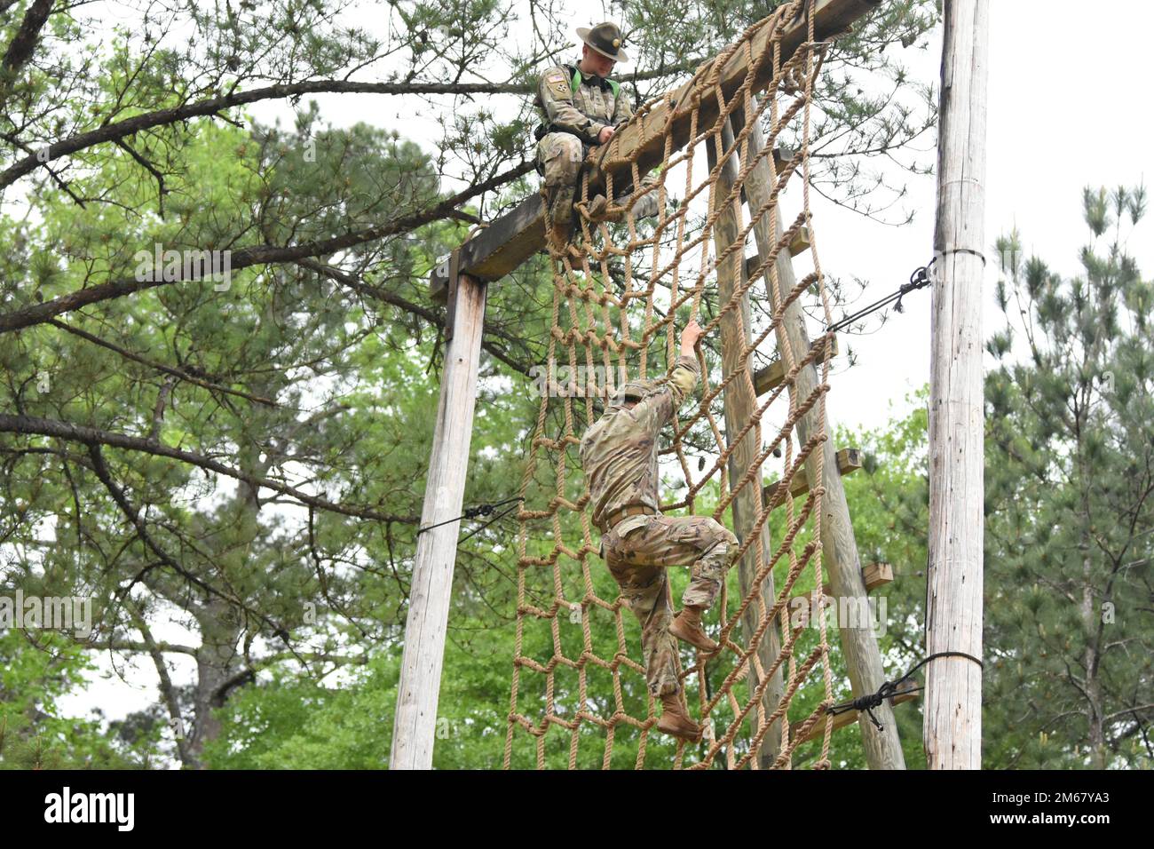 A Basic trainee completes obstacles at Fort Benning's Confidence Course ...