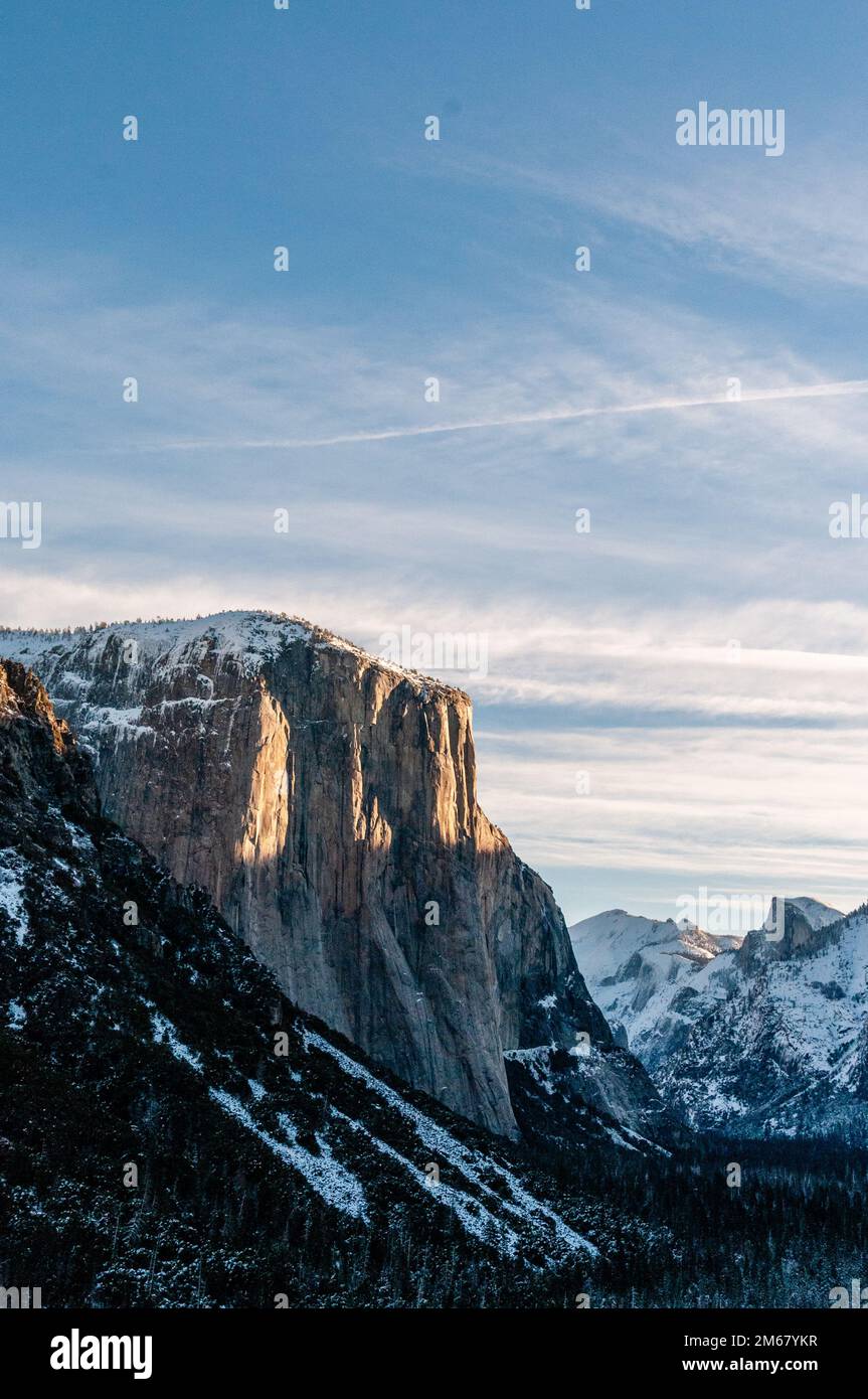 The first rays of the morning sun reflect off the rocks of the Sierra ...