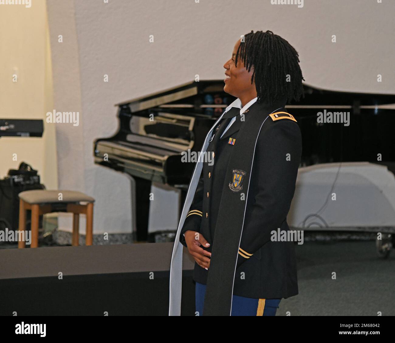 Chaplain (1st Lt.) Ruth A. Gakunga listens to speakers during a Passing ...
