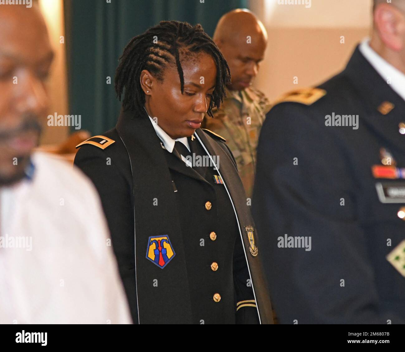 Chaplain (1st Lt.) Ruth A. Gakunga prays to God during a Passing of Stole ceremony, officially ...
