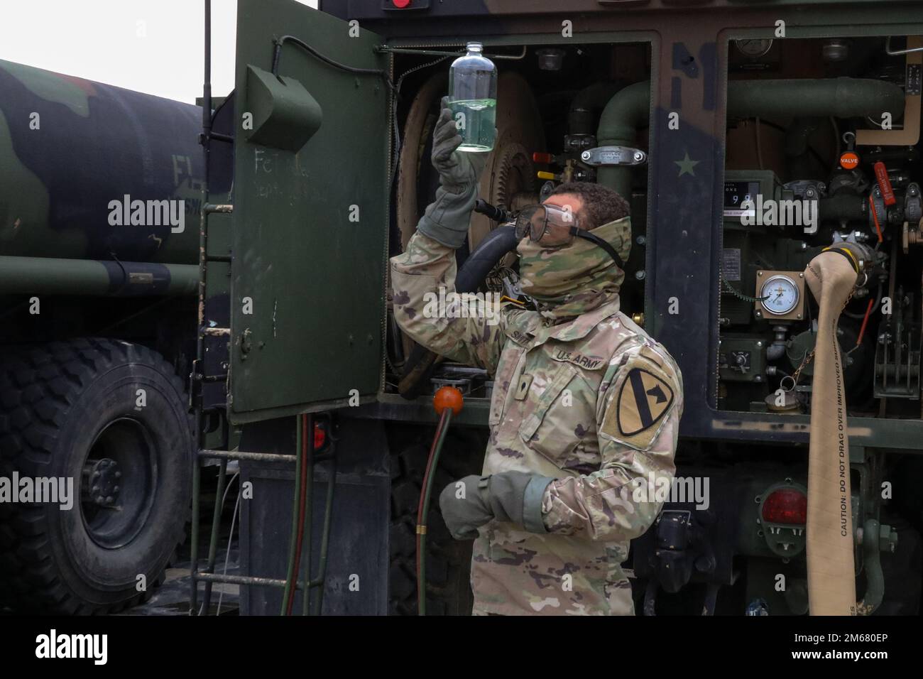 U.S. Army Spc. Antoine Smith, a fuel handler specialist assigned to 1st ...