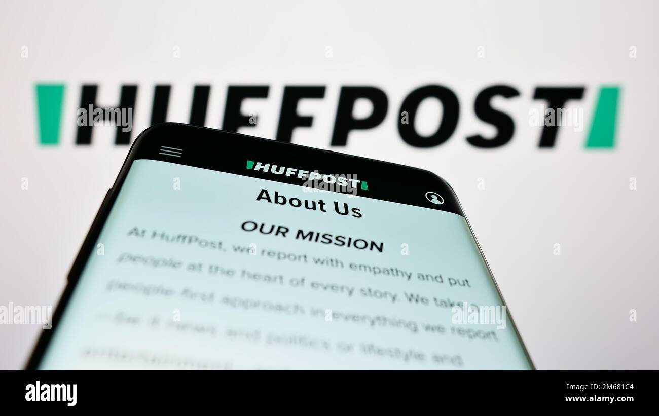 Smartphone with website of US news company HuffPost on screen in front ...