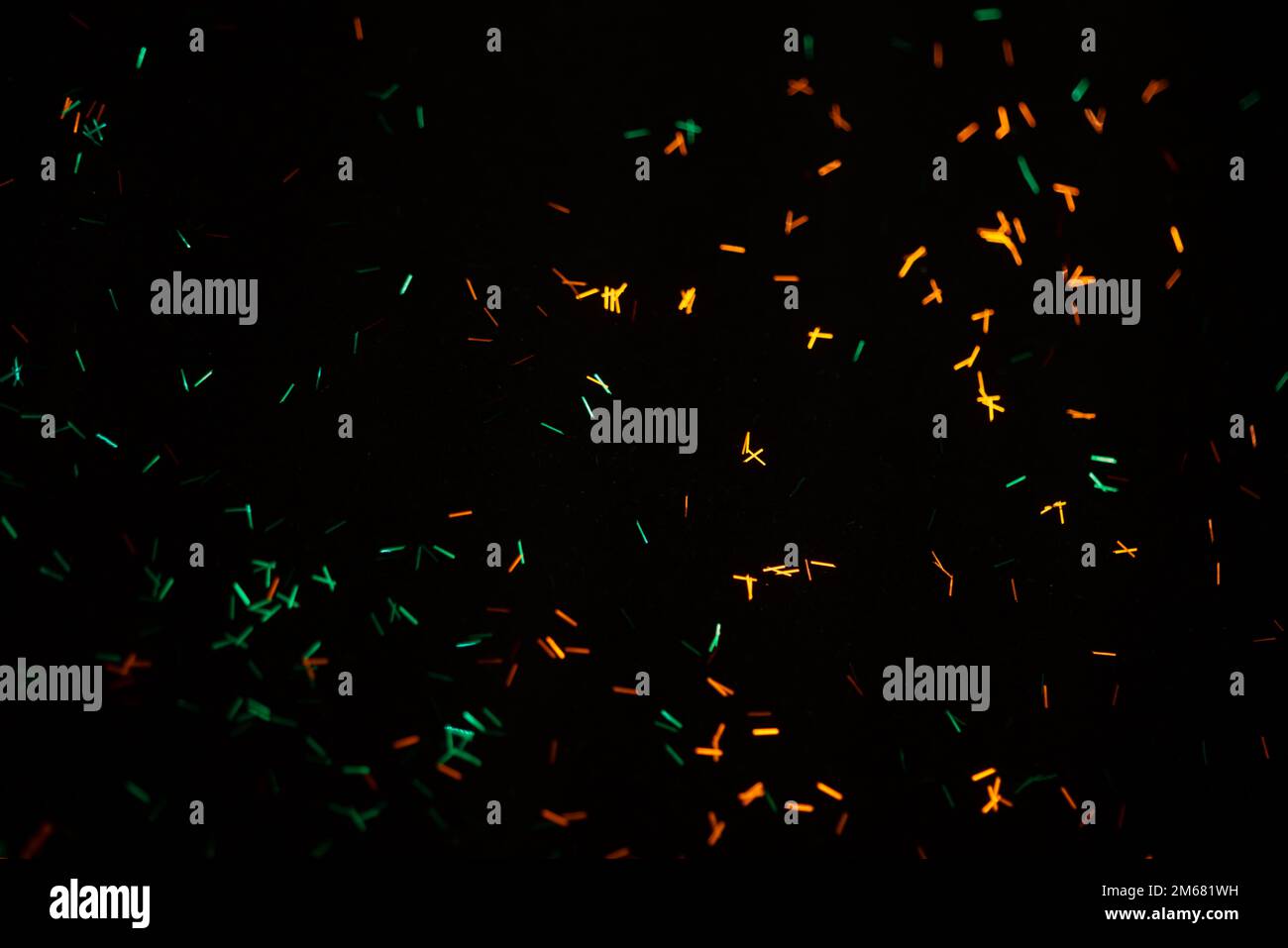 Party Colorful Glitter Confetti on Black Background Stock Photo - Alamy