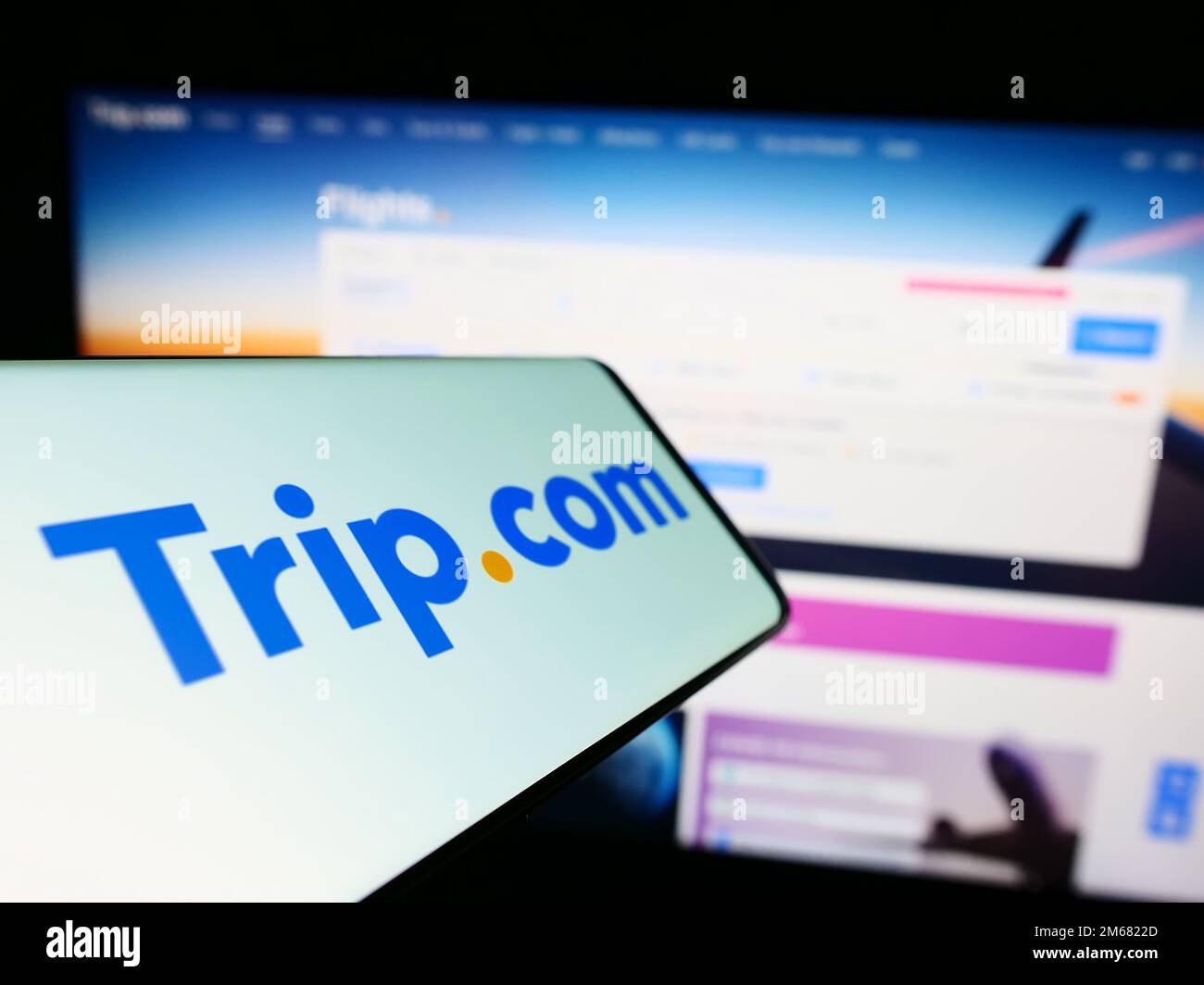 Smartphone with logo of Chinese travel company Trip.com Group Limited ...