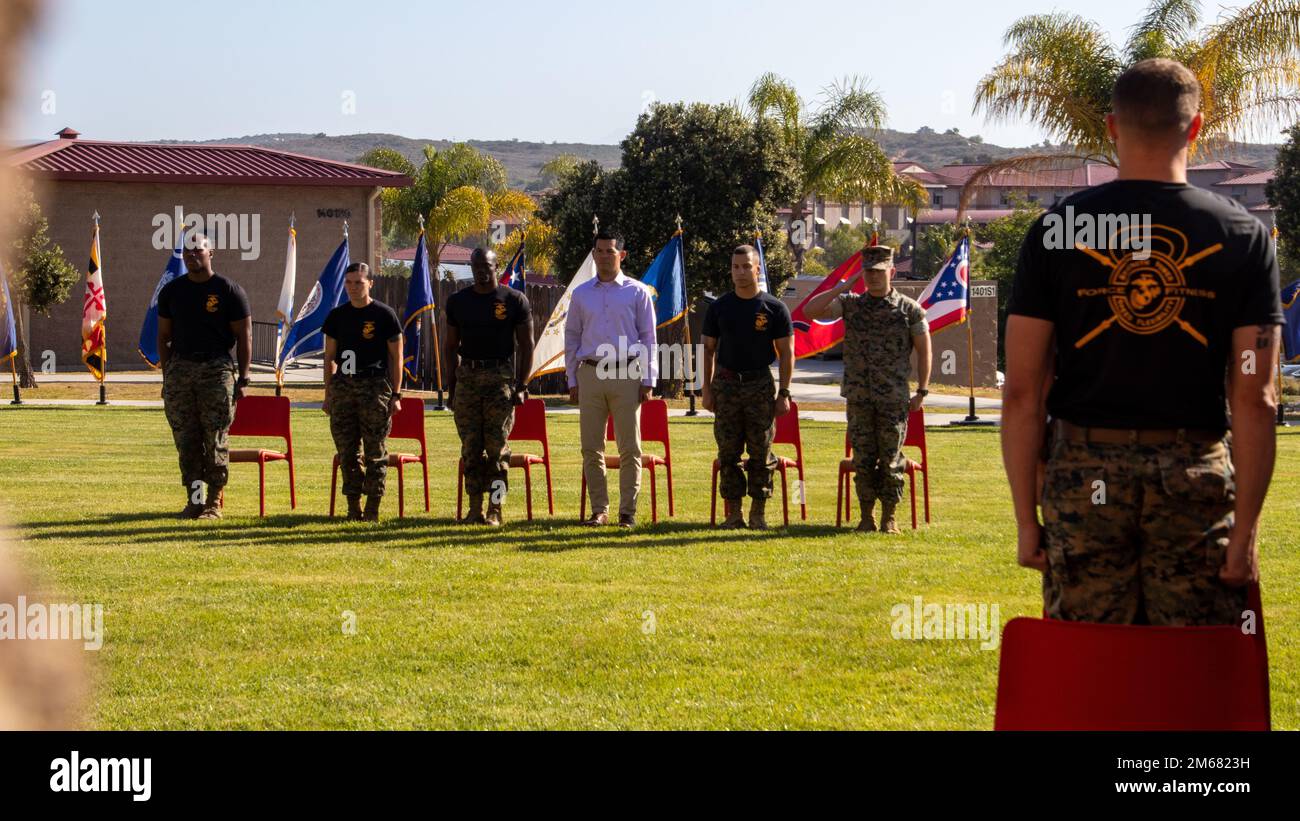 U.S. Marines stand for the playing of the national anthem during a ...