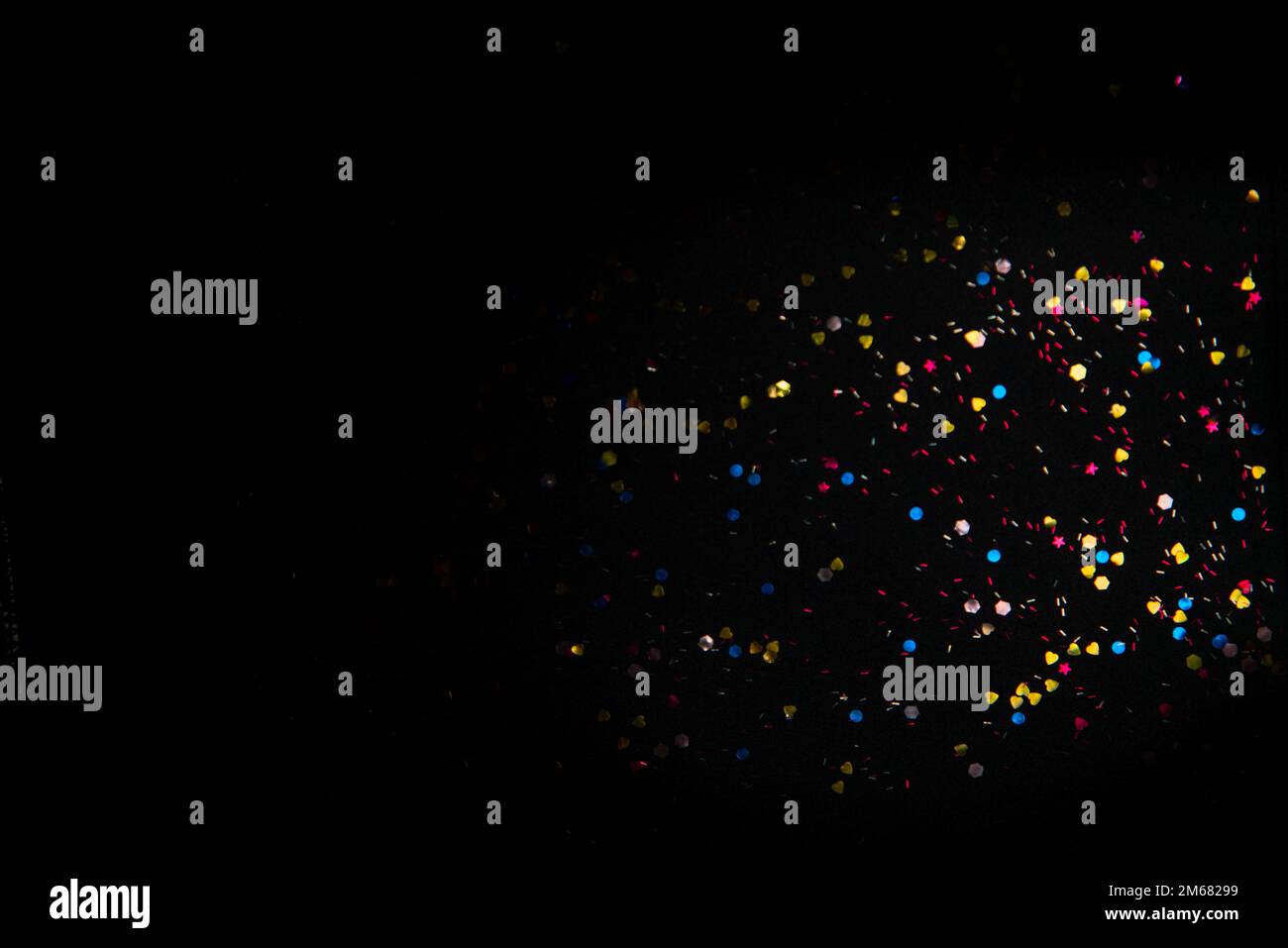 Party Colorful Glitter Confetti on Black Background Stock Photo - Alamy