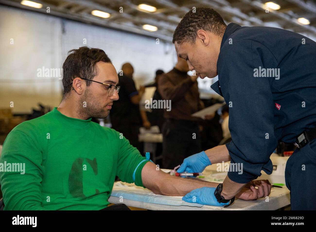 Hospital Corpsman 2nd Class Larry Crew, right, from Liberty Hill, Texas ...
