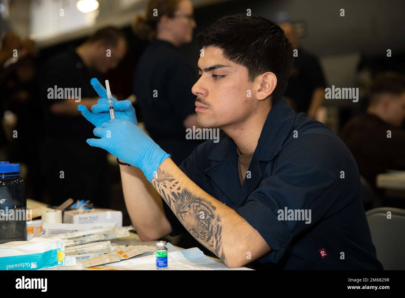 Hospitalman Michael Mino, from Newark, New Jersey, assigned to USS ...
