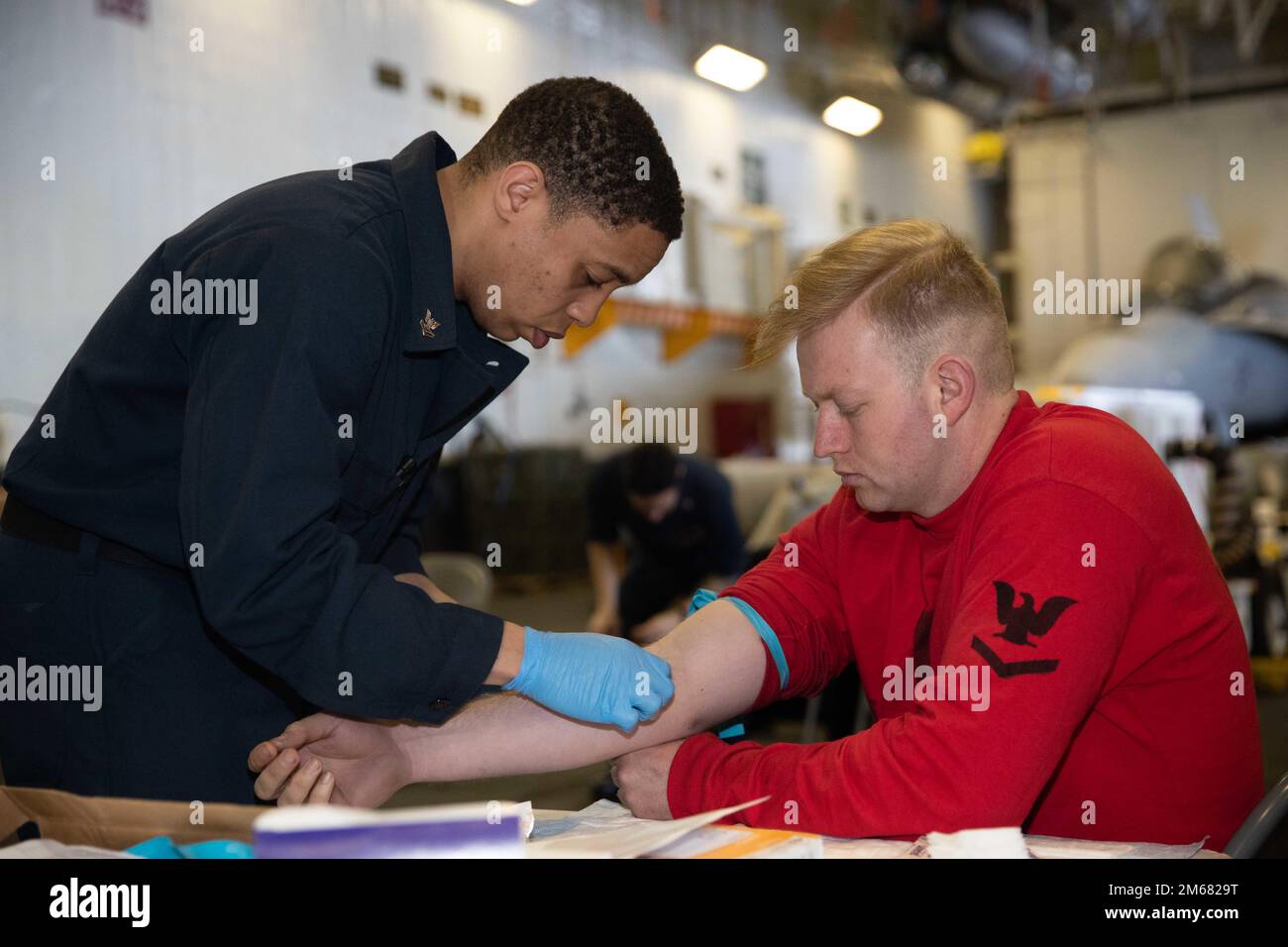 Hospital Corpsman 2nd Class Larry Crew, left, from Liberty Hill, Texas ...