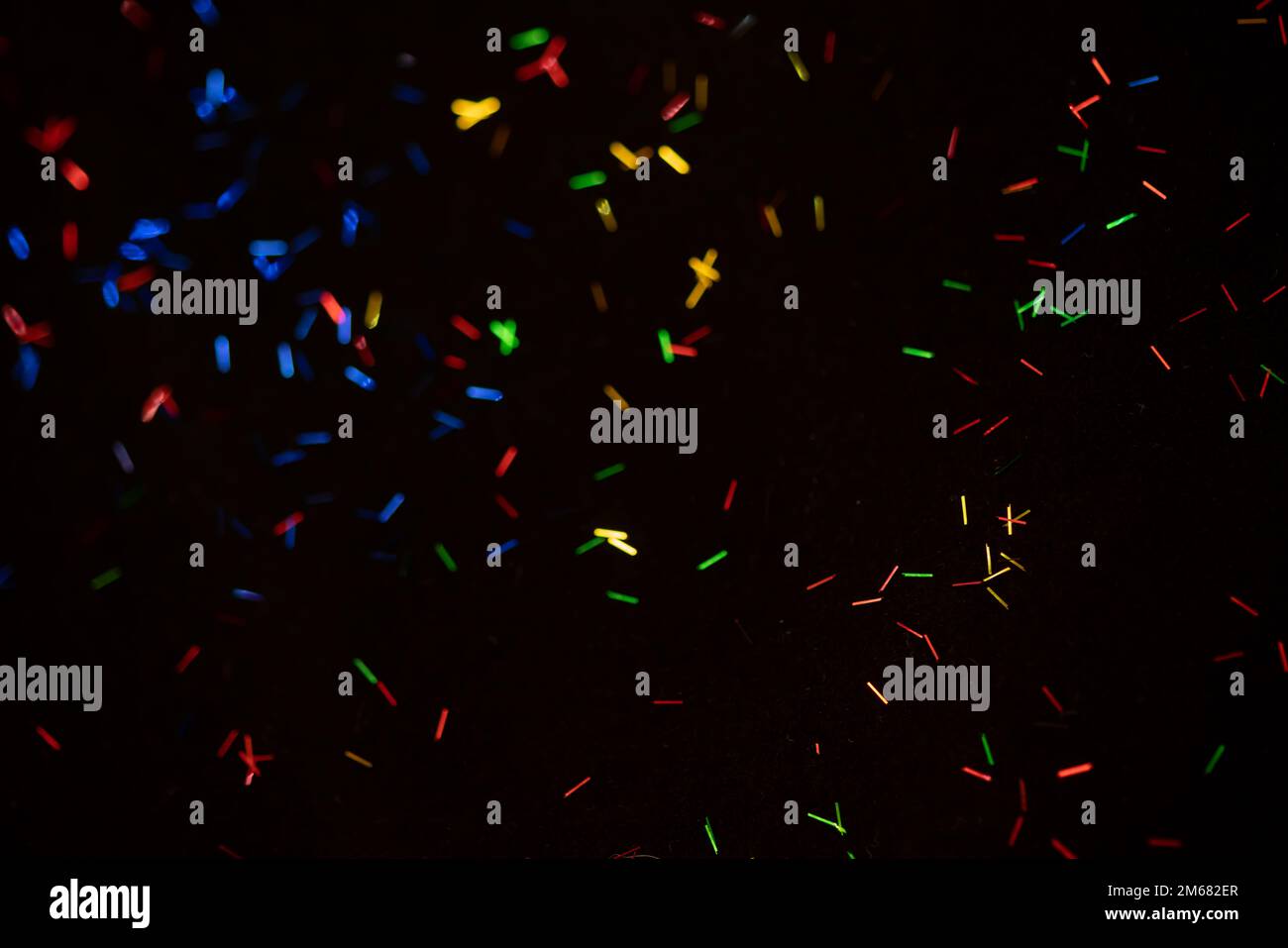 Party Colorful Glitter Confetti on Black Background Stock Photo - Alamy