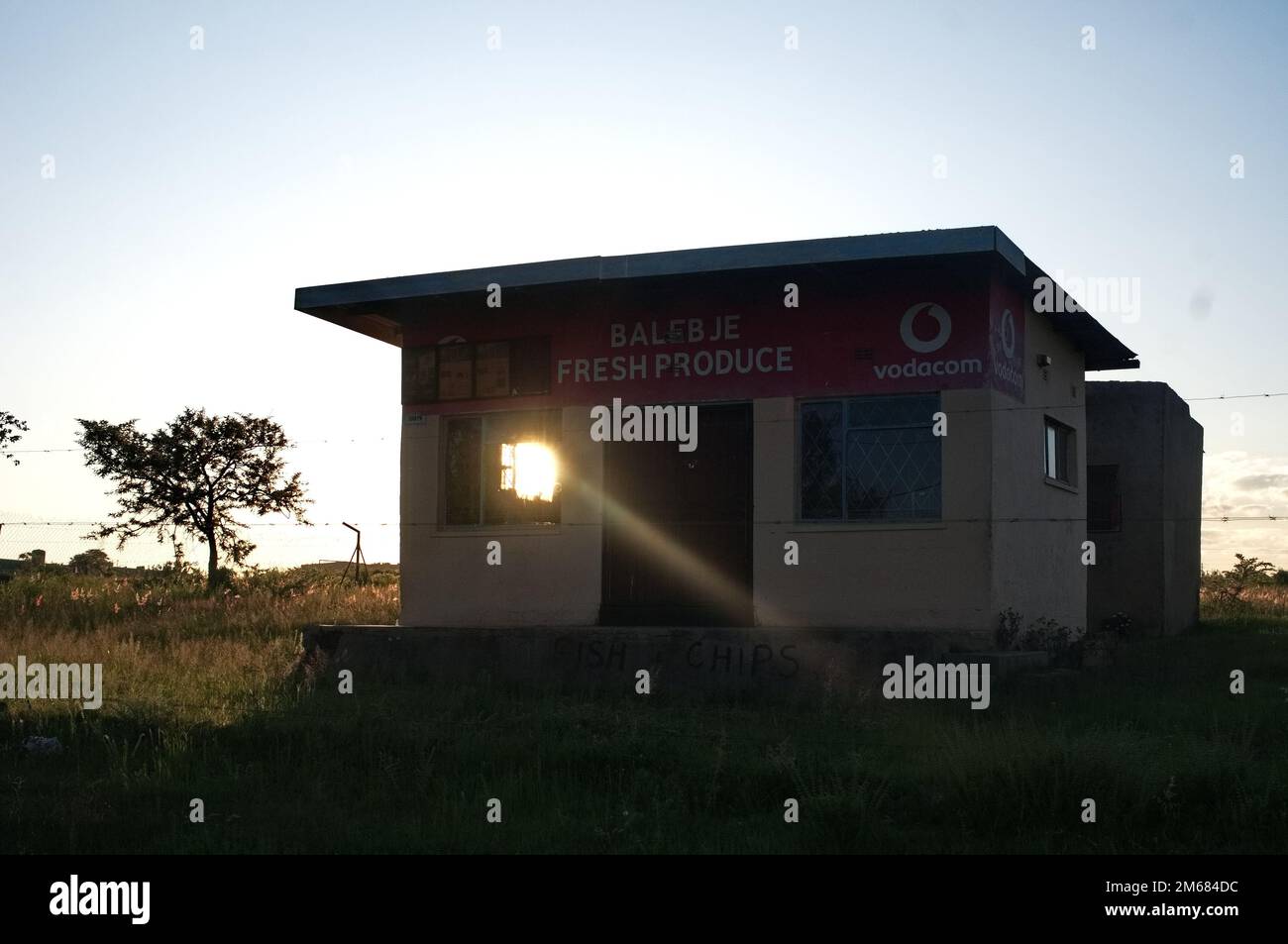 shadows at sunset in African village on a late summer depicting slow ...