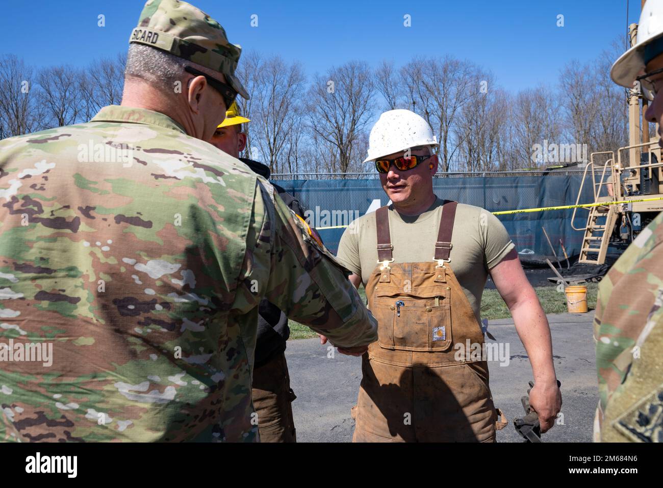 U.S. Army Command Sgt. Maj. Roger Sicard, left, the state Command ...