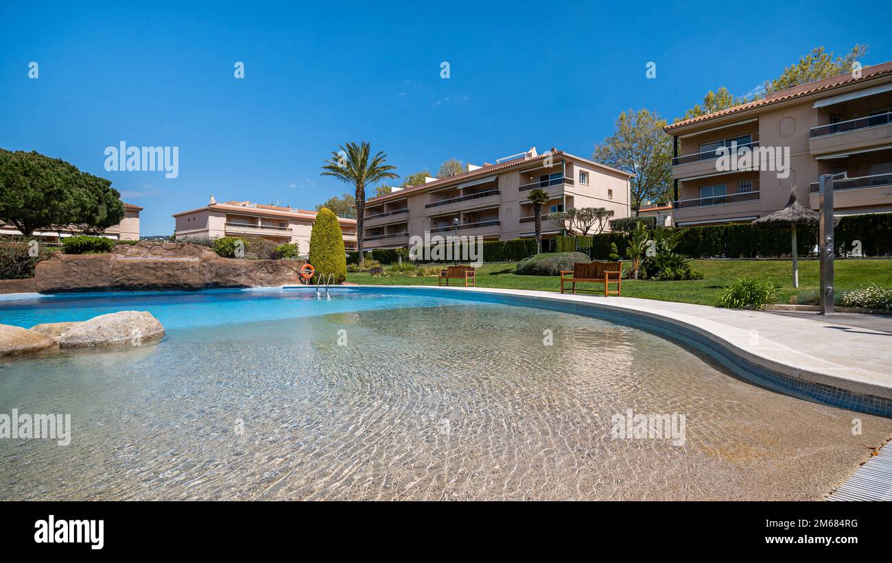 Small shallow pool with clear water on territory of hotel complex for ...