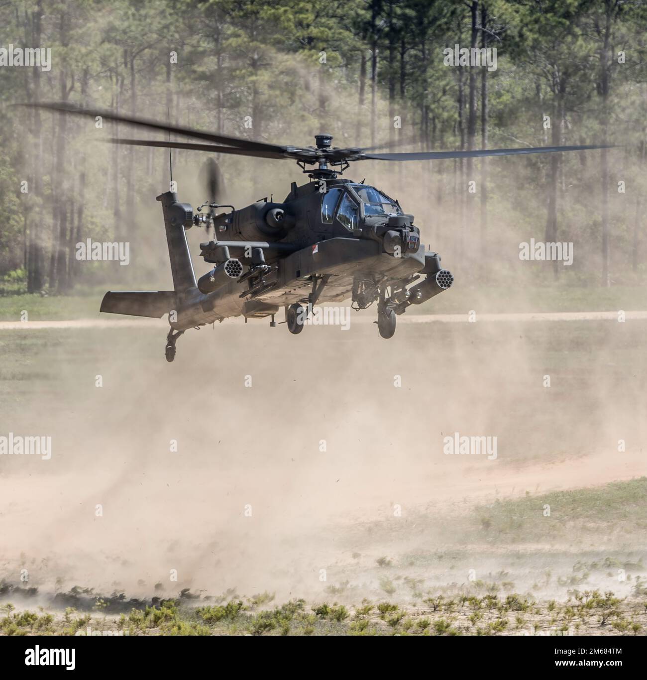 An AH-64E Apache helicopter takes flight during an aerial gunnery ...