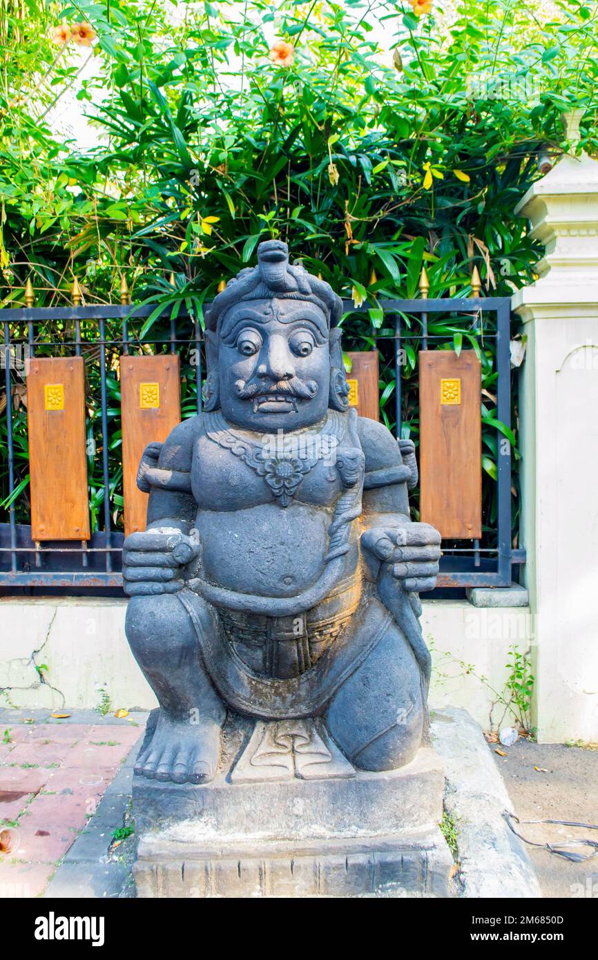 a typical Balinese statue is displayed in front of the house Stock ...