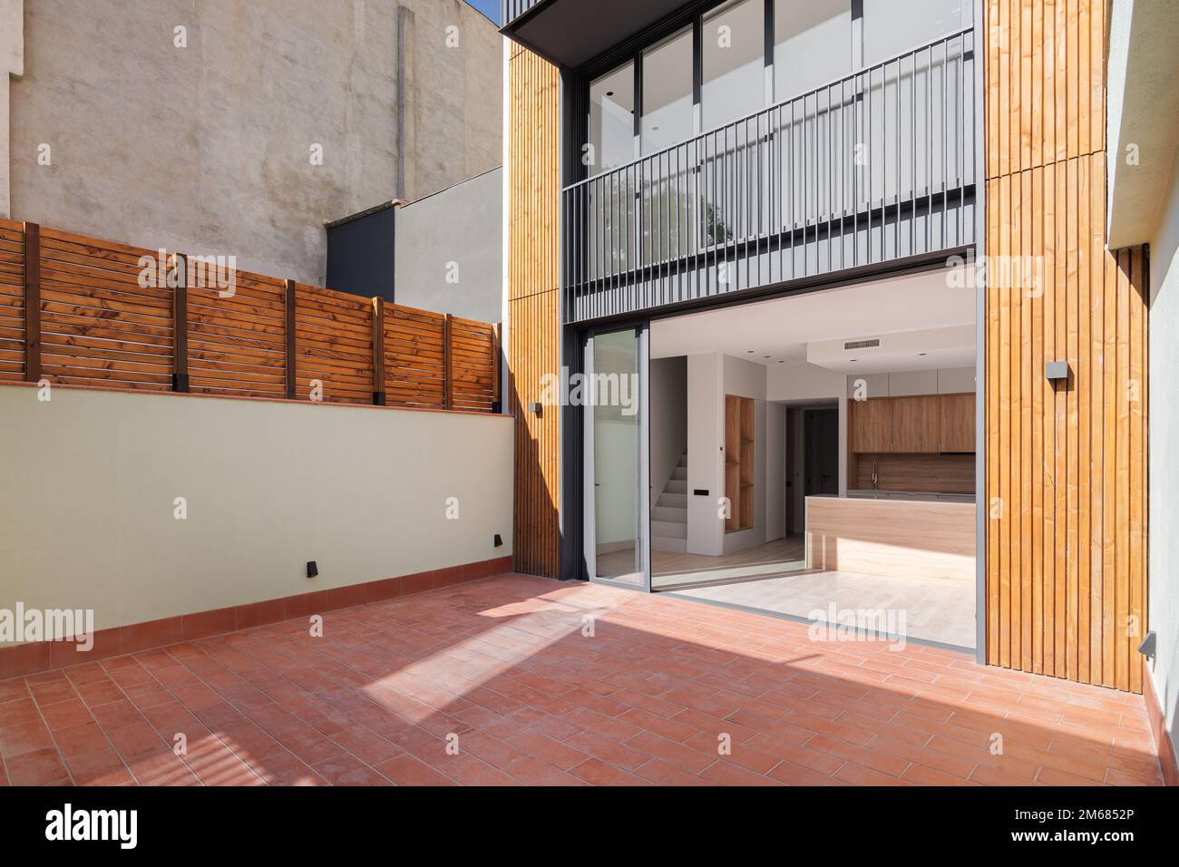 View from the fenced terrace inside a large house through large glass ...
