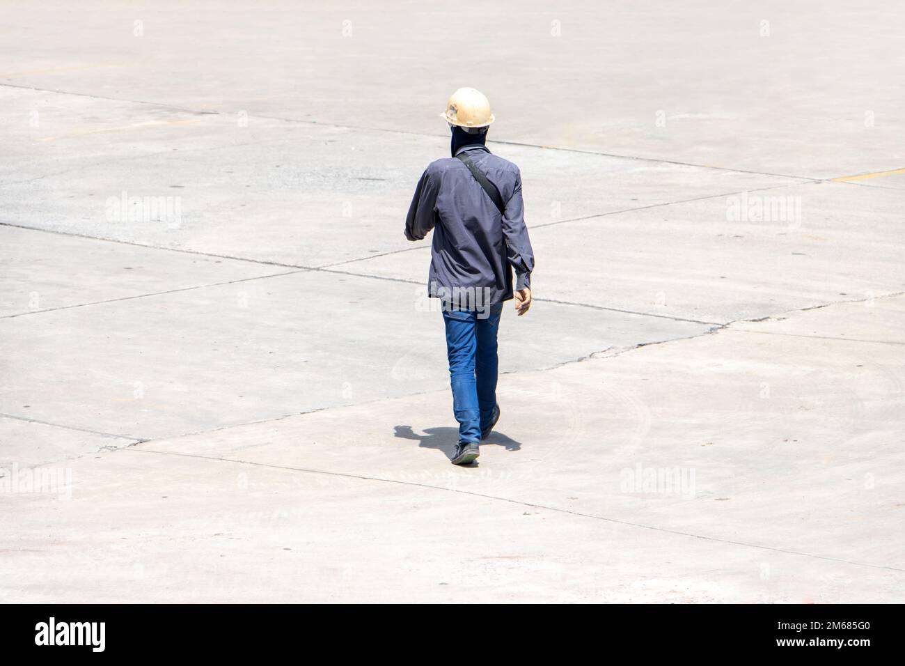 Guy Walking Away On Street