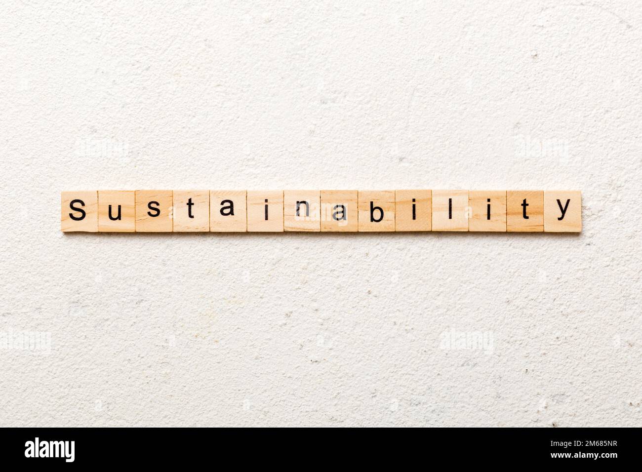 Sustainability word written on wood block. Sustainability text on table ...