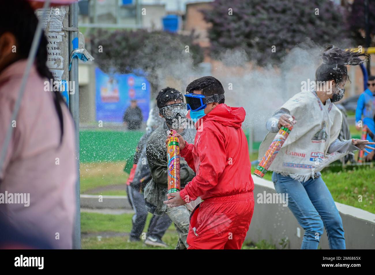 Children play with foam and talc at the Multicolor Carnival of the ...