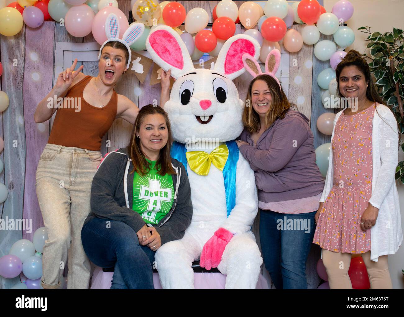 Members of Team Dover pose with the Easter bunny for a photo during the ...