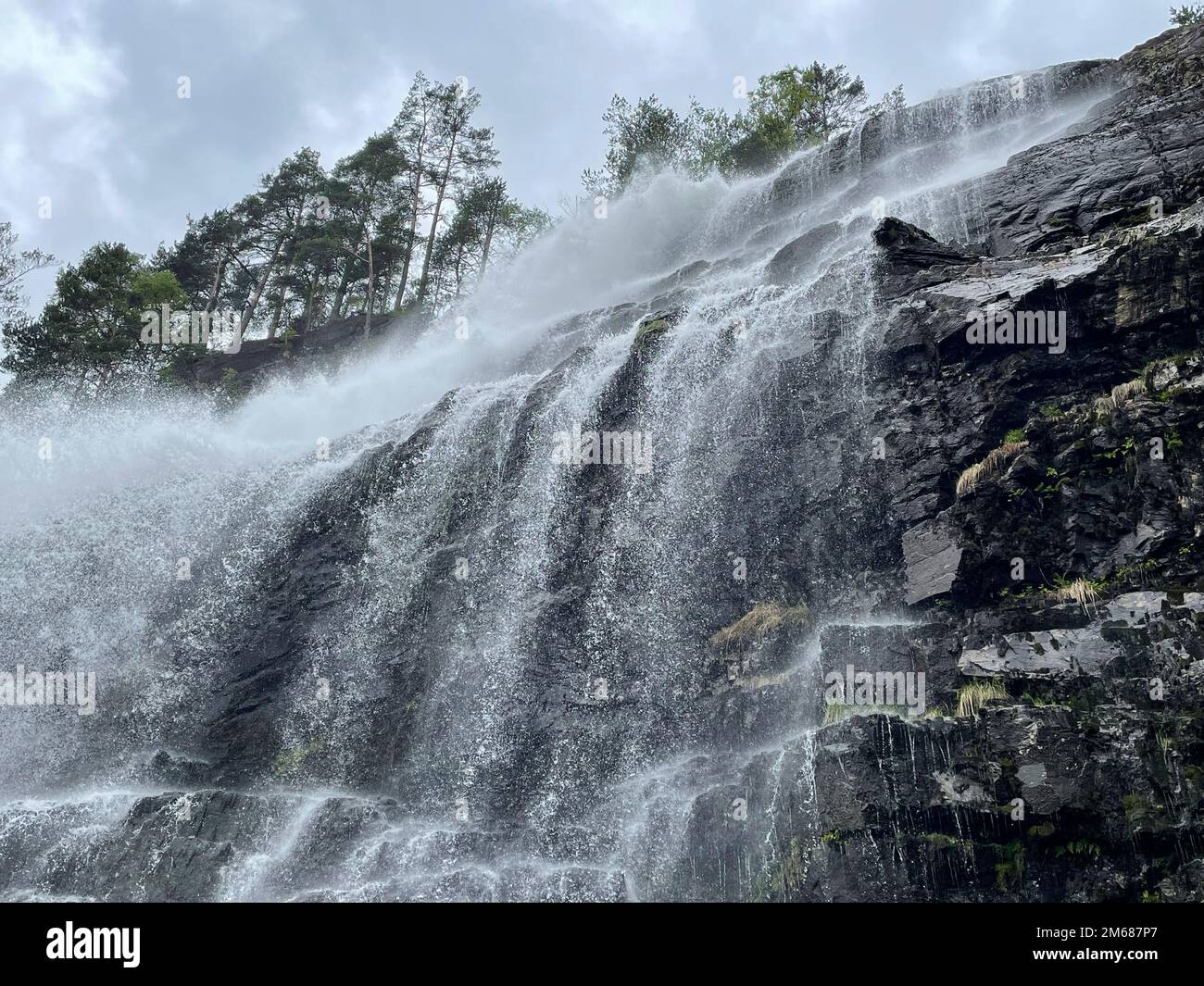 A beautiful shot of flowing splashing Svandalsfossen waterfall in Sauda ...