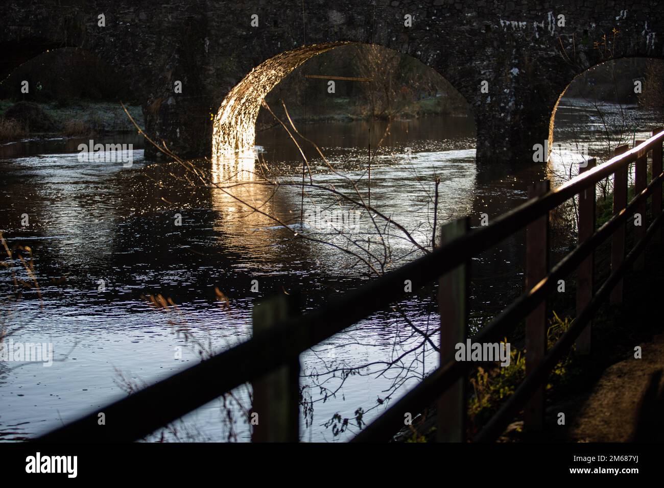 Low winter light striking the barrel of Shaw's Bridge in Belfast, UK ...