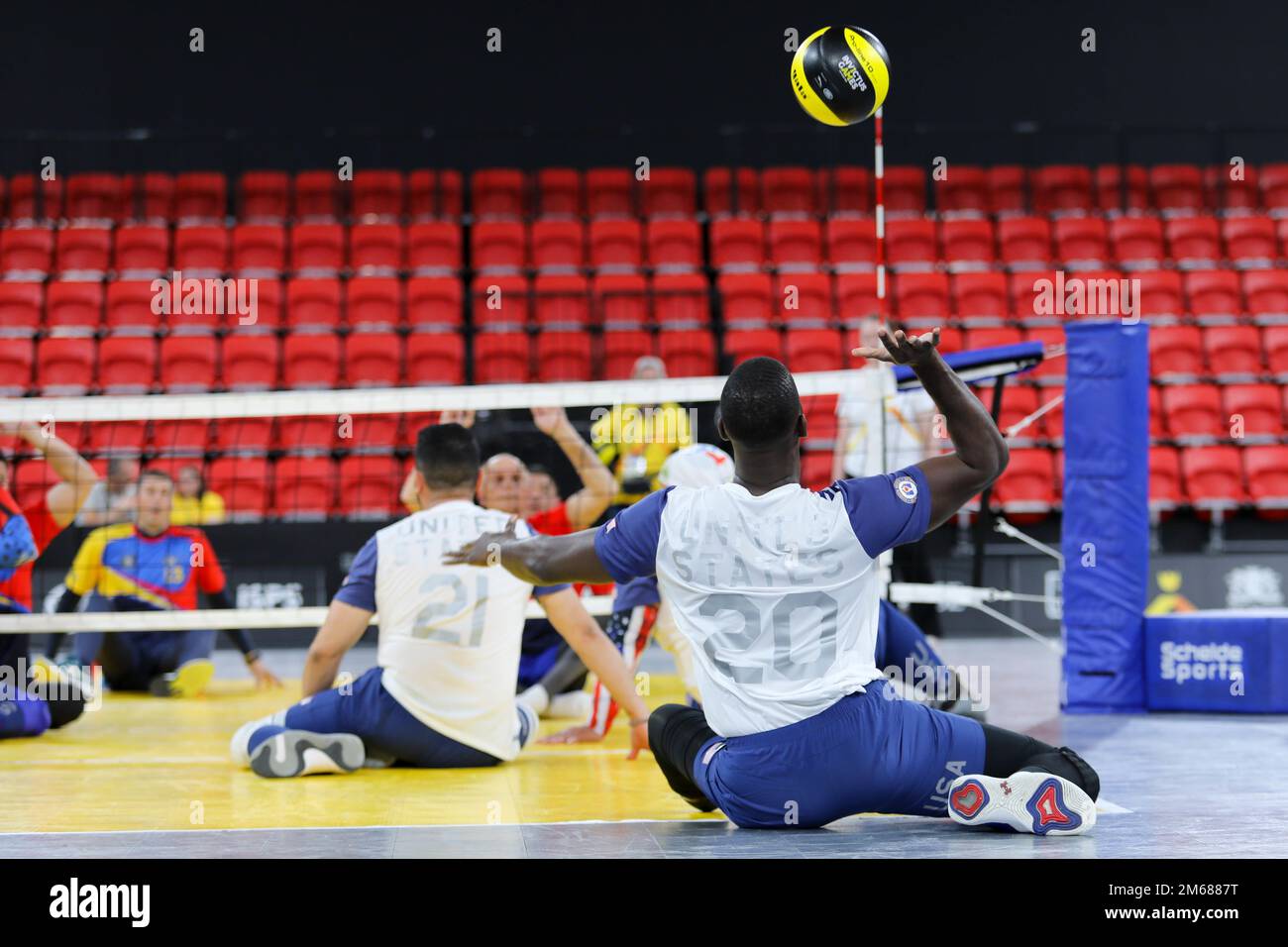Team U.S. competes in a sitting volleyball match against Team Romania ...