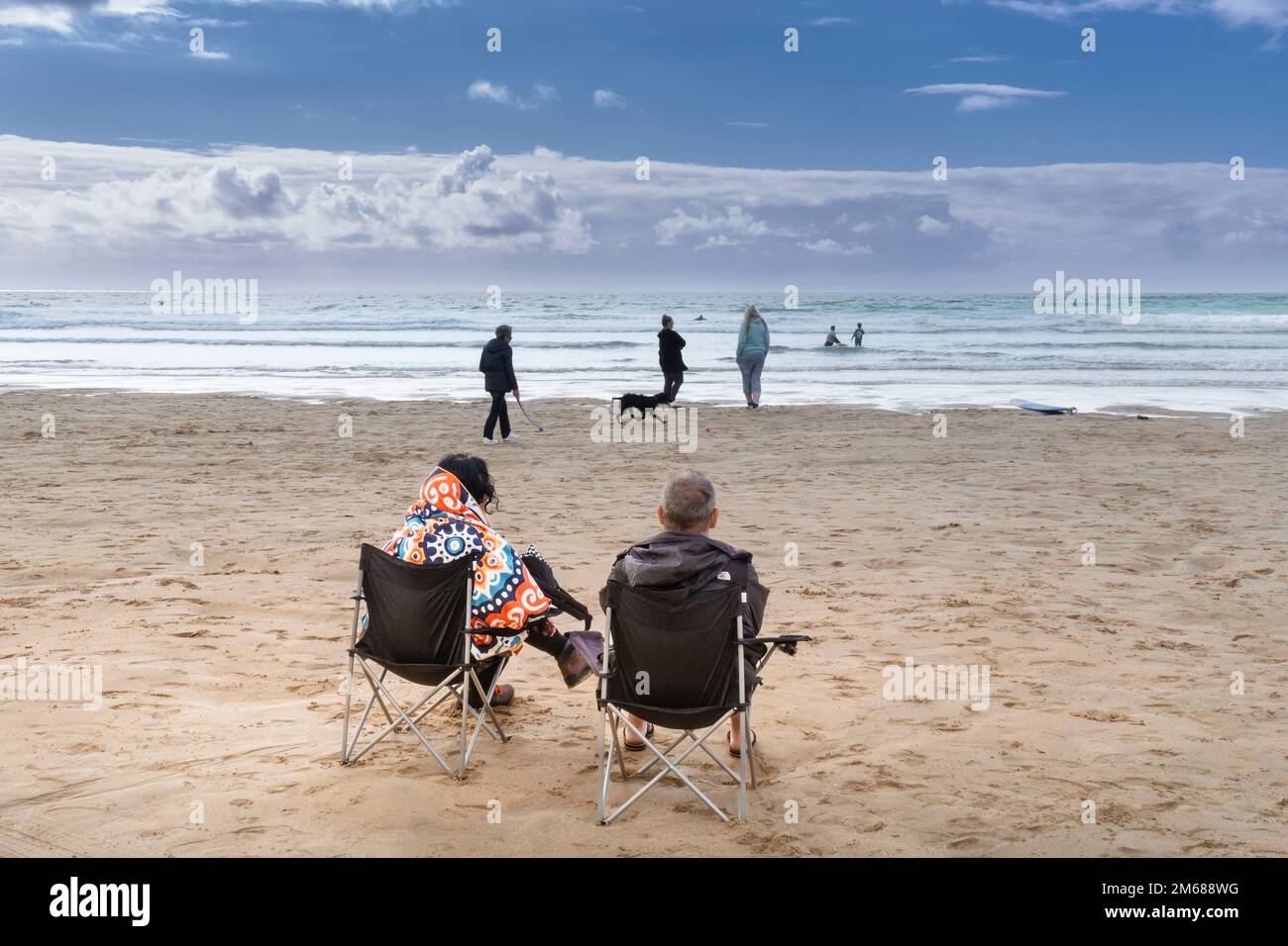 People sitting in beach chairs hi-res stock photography and images - Alamy