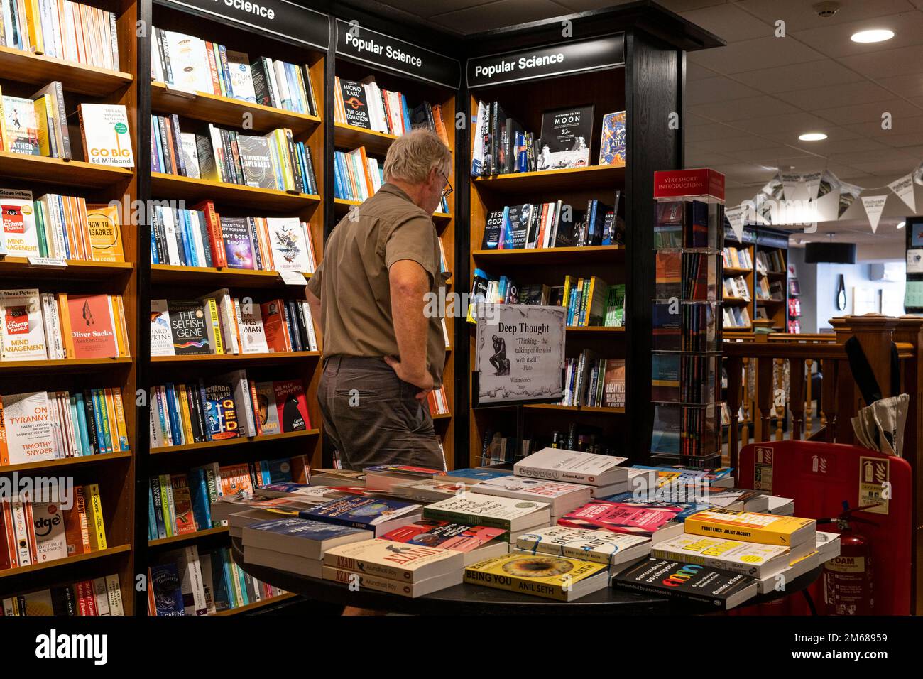 A male customer browsing in a Waterstones Bookshop Bookstore Stock ...