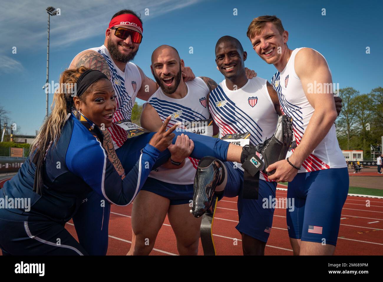 Team U.S. athletes pose for a photo during an athletics competition for ...