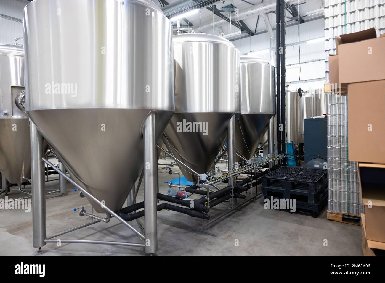 Modern interior of a beer plant with big vats Stock Photo - Alamy